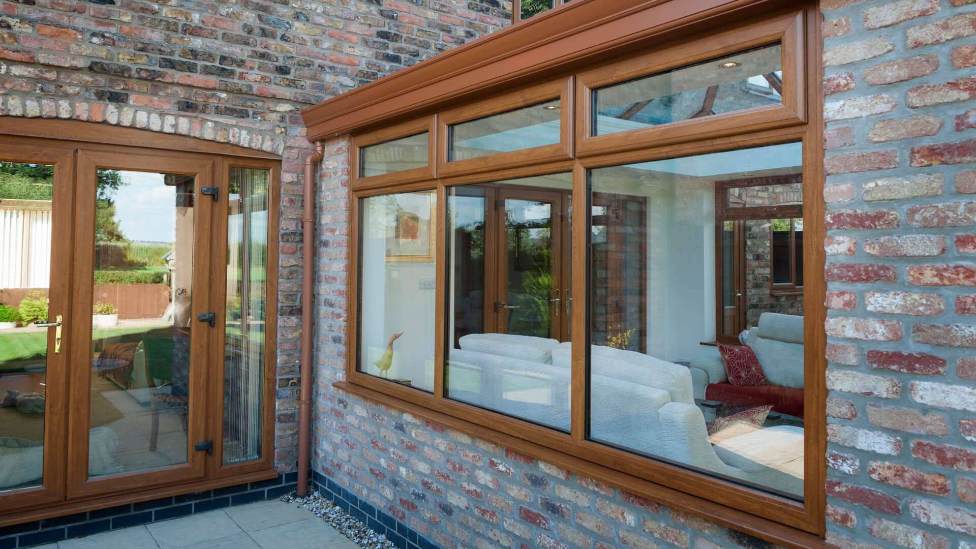 Golden Oak Orangery With French Doors by West Yorkshire Windows